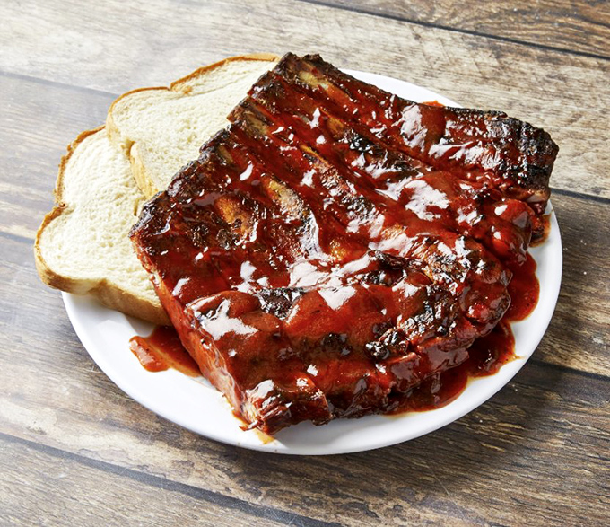 These ribs aren't just falling off the bone &ndash; they're practically volunteering to jump onto your plate with a perfect lacquer of sauce.