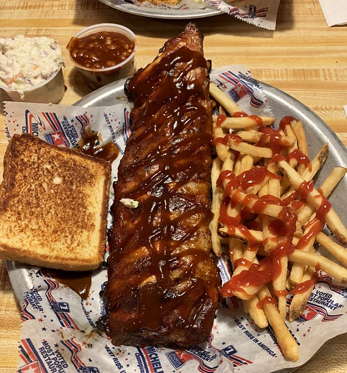 Behold the star of the show! These baby backs glisten with sauce, promising the kind of flavor that makes conversation stop mid-sentence.