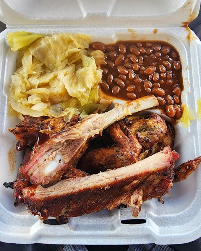 Behold the holy trinity of BBQ perfection: smoky ribs, tender cabbage, and saucy baked beans that would make your grandma jealous.
