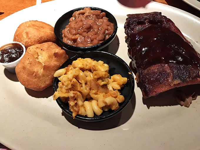 Behold barbecue perfection: saucy ribs alongside mac and cheese that could make your grandmother question her recipe.