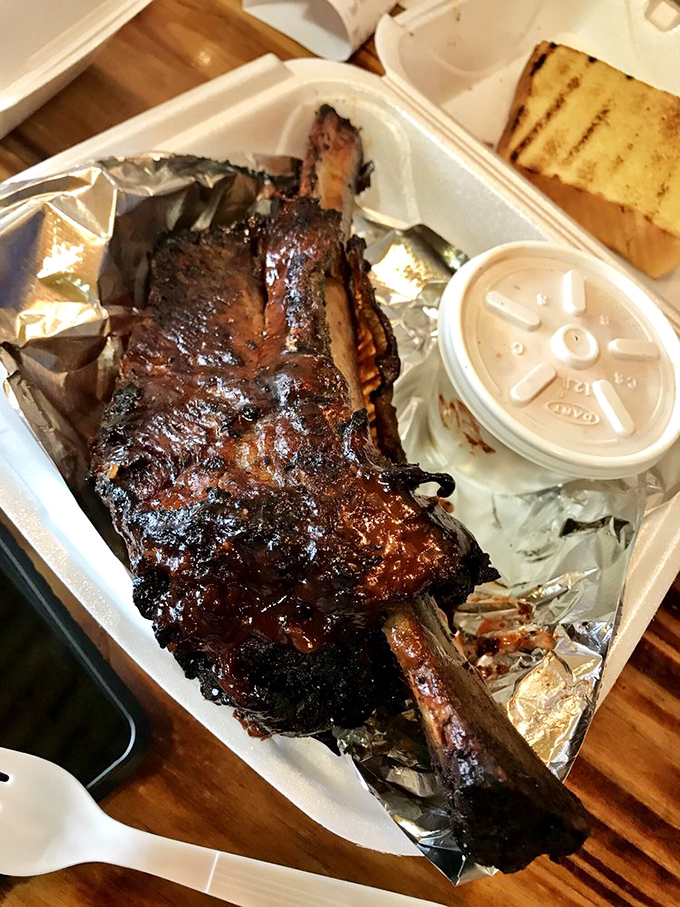Behold the star of the show: ribs with a bark so perfect it deserves its own standing ovation. That smoke ring is hypnotic.