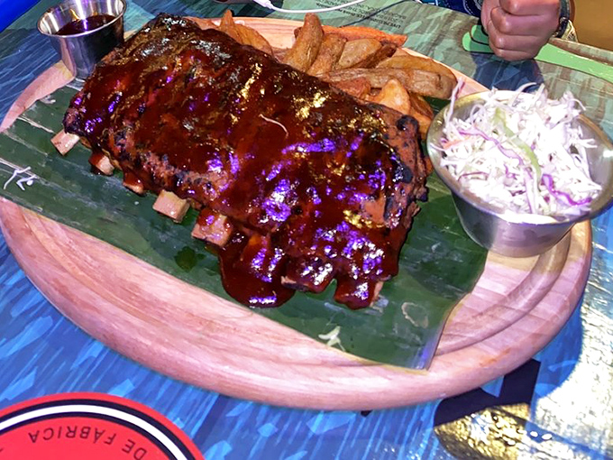 These BBQ ribs don't just fall off the bone&mdash;they practically leap into your mouth, glistening with a sauce worth bottling and taking home.