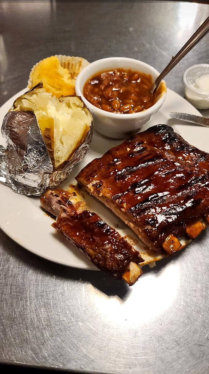 These ribs don't just fall off the bone&mdash;they practically leap into your mouth, bringing along their baked potato and beans companions for the ride.