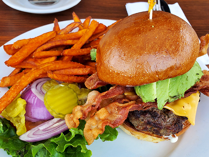 The star of the show: a bacon avocado burger that deserves its own agent. Crispy bacon, creamy avocado, and a perfectly cooked patty with sweet potato fries.
