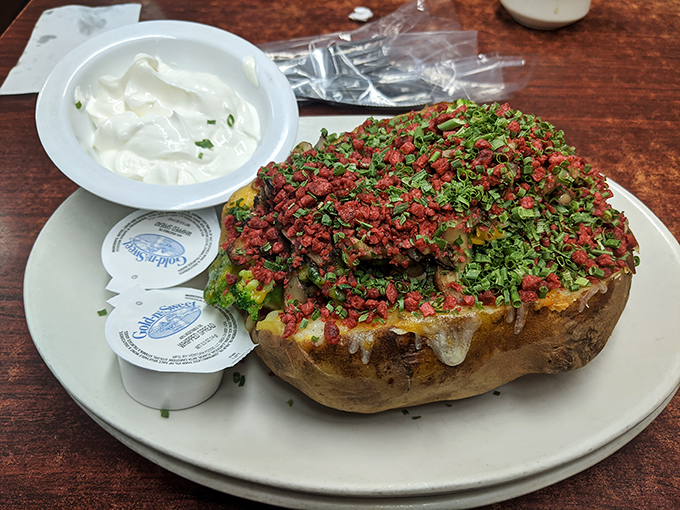 Behold the potato that launched a thousand road trips: loaded, legendary, and larger than reasonable expectations.