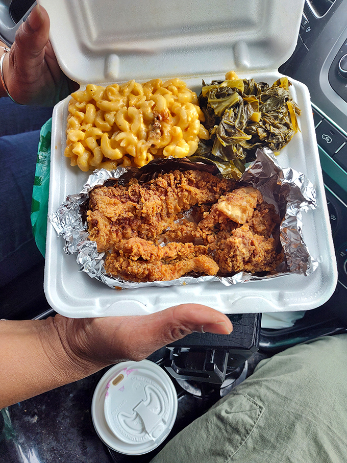 Behold the mac and cheese that could make a grown person weep, paired with collard greens and chicken that's practically swimming in savory gravy.