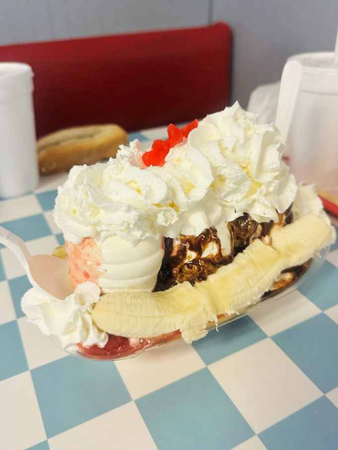 The banana split that launched a thousand road trips. Three scoops nestled between fresh banana, crowned with whipped cream and cherries&mdash;worth every mile of the journey.