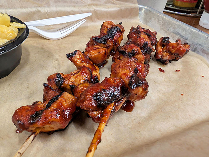These glazed chicken skewers aren't just cooked, they're transformed&mdash;wearing their char marks like badges of honor earned in the smoker's chamber.