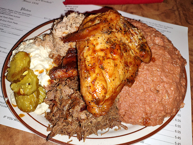 Not just a plate of food but a work of art – that chicken quarter glistening with sauce alongside hash and pulled pork is Georgia on a plate.