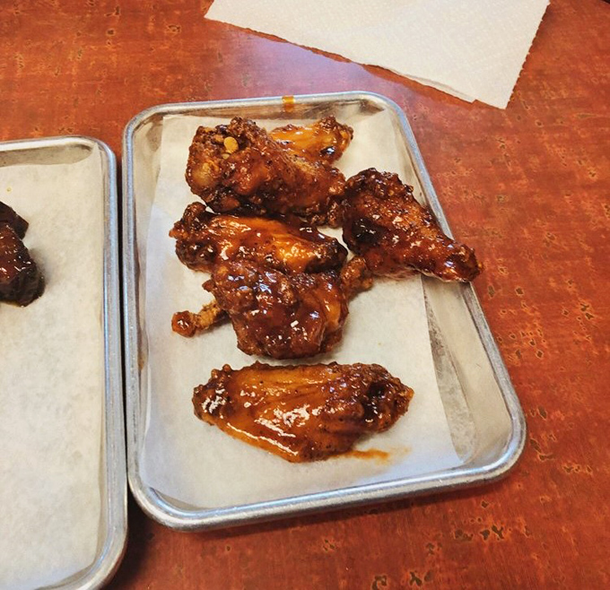 These wings aren't just glazed, they're transformed – like butterflies that emerged from their cocoons as sticky, sweet-heat flavor bombs.
