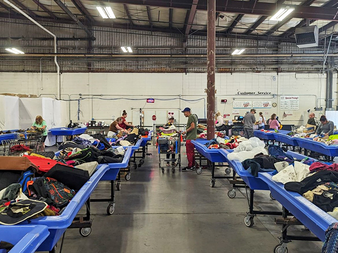 Behind the scenes where the magic happens &ndash; volunteers transform mountains of donations into organized opportunity zones.