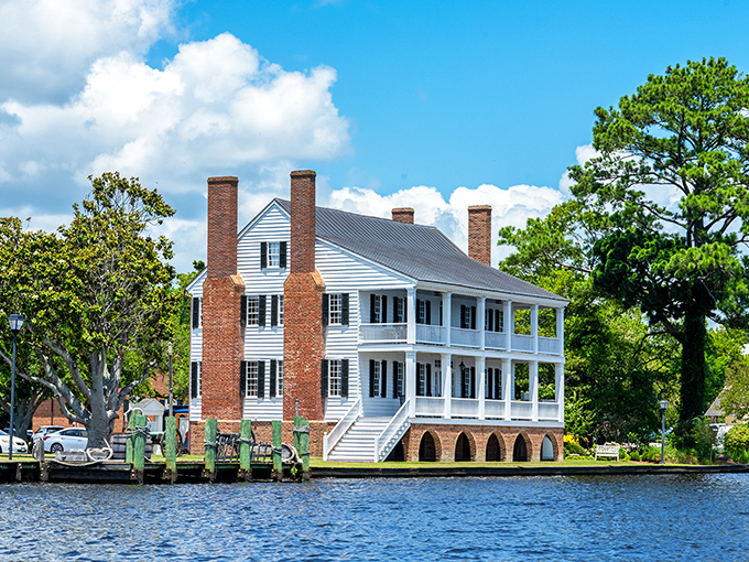 The stately Barker House stands as Edenton's waterfront sentinel, its four chimneys and wraparound porch practically demanding you sip something cold on the veranda.
