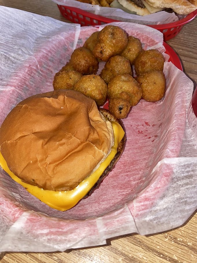 Golden-brown perfection arrives in a basket, proving that sometimes the simplest pleasures are the most satisfying.