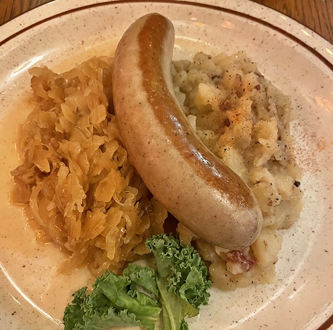 This bratwurst isn't just having a spa day on your plate &ndash; it's lounging luxuriously with sauerkraut and potato salad in a perfect harmony of German flavors.