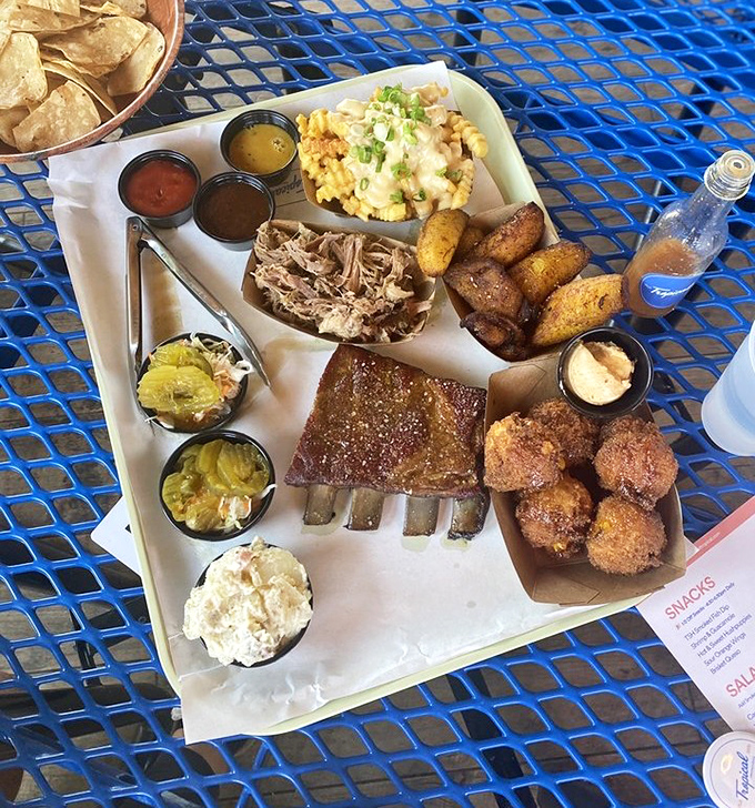 BBQ nirvana on a single tray. Those ribs have clearly been on a slow, smoky journey to perfection.
