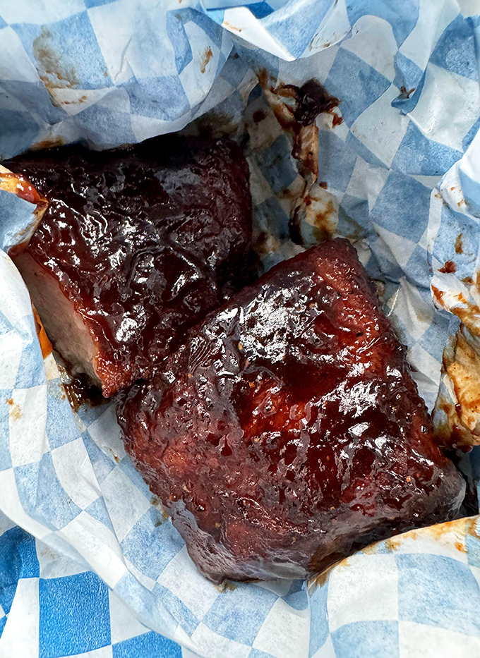 Glistening pork belly burnt ends that would make a vegetarian question their life choices. Sticky, sweet, and unapologetically indulgent.