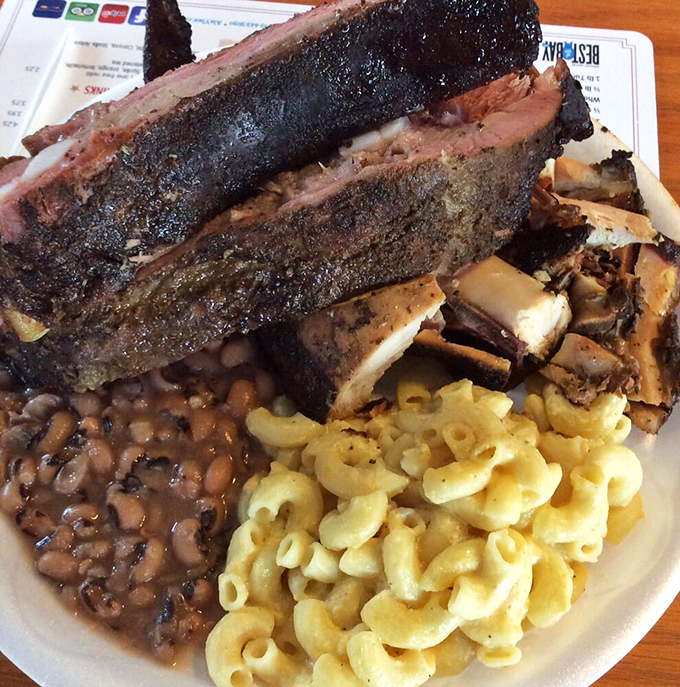 Behold the holy trinity of Southern comfort: fall-off-the-bone ribs, creamy mac and cheese, and black-eyed peas that would make your grandma jealous.