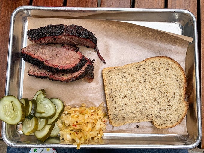 Behold the brisket in all its glory&mdash;sporting a bark so perfect it deserves its own hall of fame induction, alongside pickles that cut through the richness like a well-timed joke. 