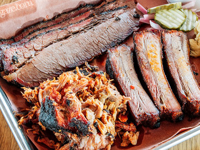 Behold the holy trinity of BBQ perfection: that pink smoke ring, that glistening bark, and that tender brisket that barely needs a knife.