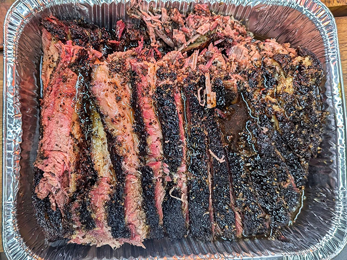 Behold the holy grail of smoked meats: brisket with a bark so perfect it deserves its own exhibition at the Louvre. That smoke ring isn't just pink&mdash;it's a halo.