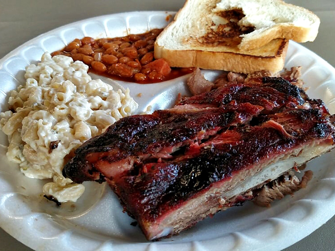 This isn't just brisket; it's a smoke-kissed masterpiece with that telltale pink ring that makes barbecue aficionados weak in the knees.