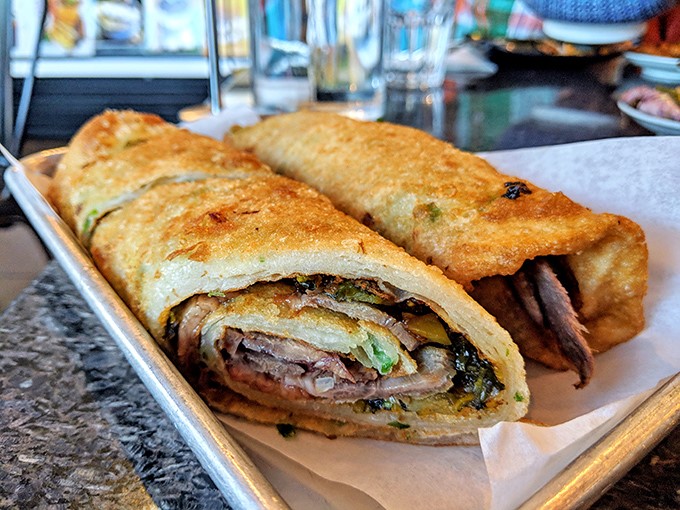 The star of the show: a perfectly crisp-yet-chewy beef pancake wrap that makes burritos nervously question their life choices.