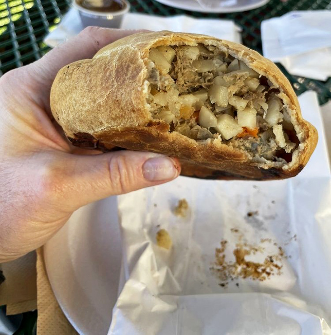 Behold the mighty beef pasty in all its cross-sectional glory! The golden-brown crust gives way to a hearty filling that would make a Cornish miner weep with joy. 