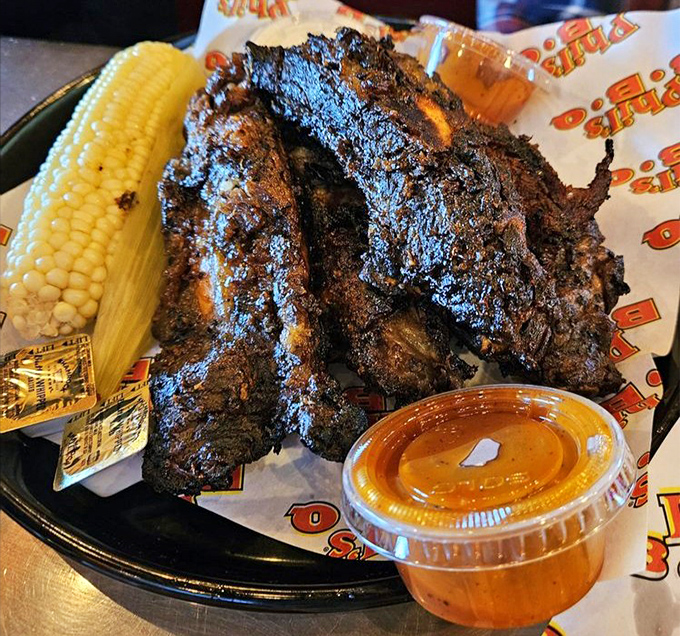 Behold the beef ribs that launched a thousand cravings. These smoky, sauce-lacquered beauties make vegetarians question their life choices and locals line up around the block.