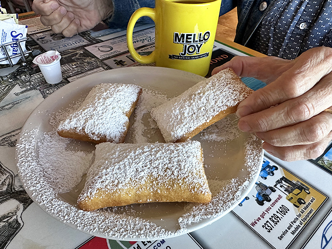These aren't just beignets &ndash; they're pillowy clouds of joy wearing powdered sugar ball gowns.
