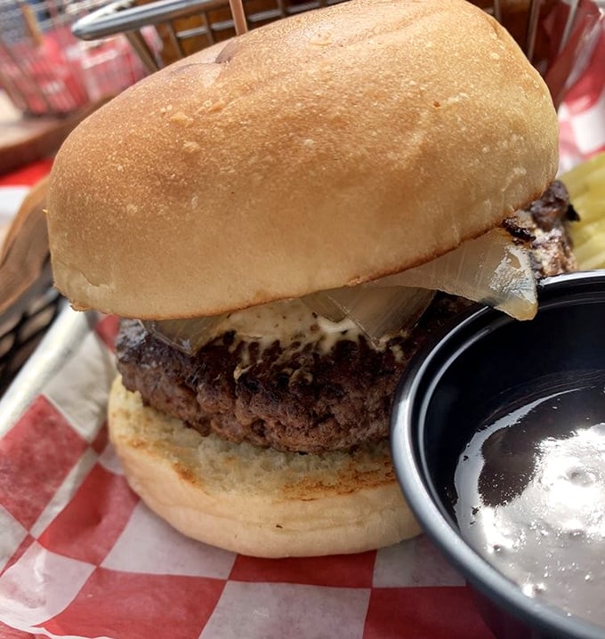 This isn't just a burger; it's a monument to beef architecture—a perfectly charred patty with melty cheese that makes your smartphone camera work overtime.