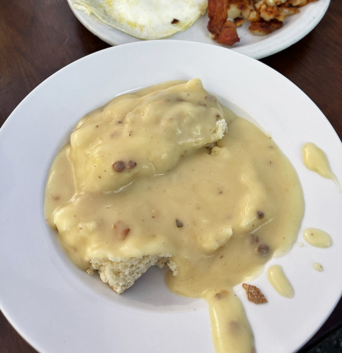The star of the show: biscuits drowning in velvety, peppery country gravy. Not a deconstructed interpretation&mdash;just the genuine article that makes you question all other breakfast decisions.