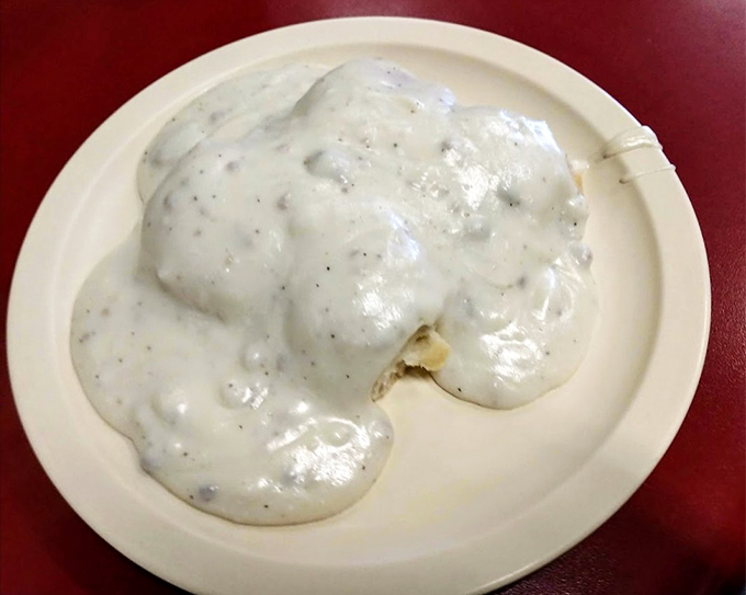 Behold the star attraction! These biscuits swimming in creamy, pepper-flecked gravy aren't just breakfast&mdash;they're an edible hug that might bring a tear to your eye.