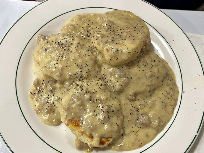 These biscuits and gravy aren't just a meal &ndash; they're a spiritual experience. That pepper-flecked gravy blankets those biscuits like they're tucking them in for a delicious nap.