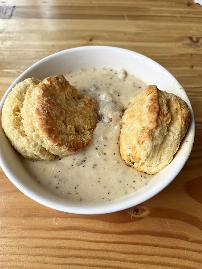 Two golden islands of flaky biscuit perfection swimming in a sea of peppery sausage gravy. This is what breakfast dreams are made of.