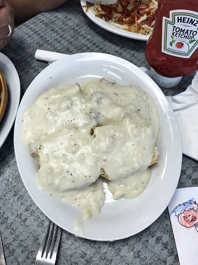 Biscuits and gravy so good they deserve their own ZIP code. That pepper-speckled blanket of creamy goodness is what breakfast dreams are made of.