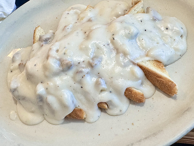 Behold the biscuits and gravy that inspired this entire article &ndash; fluffy clouds drowning in creamy, sausage-studded perfection.