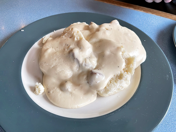 Behold the holy grail of breakfast &ndash; biscuits drowning in creamy sausage gravy that would make your grandmother simultaneously proud and jealous.