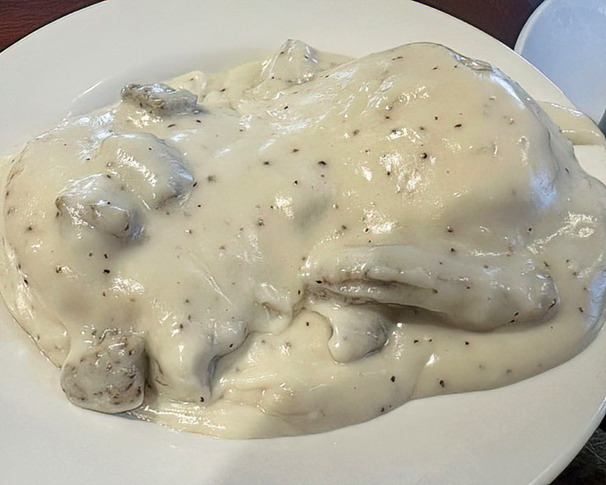 Biscuits and gravy so heavenly they should come with their own choir &ndash; creamy, peppery perfection blanketing fluffy clouds of dough.