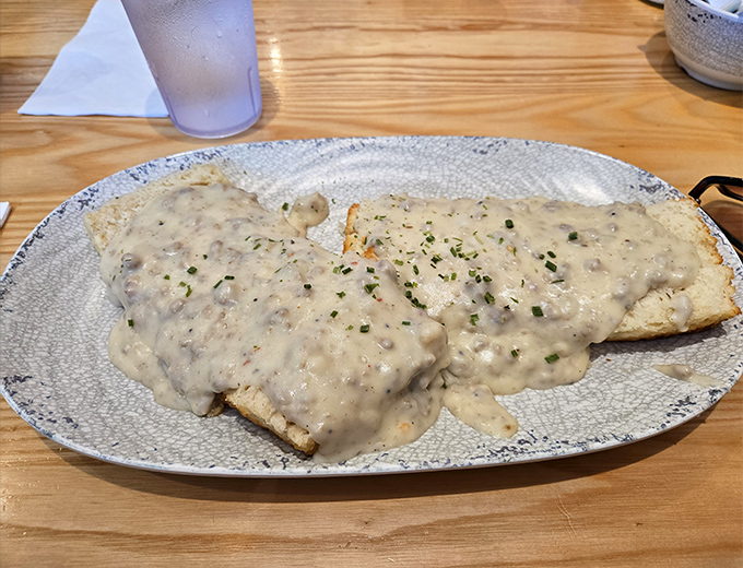 Behold the star of our show: biscuits smothered in creamy, peppery gravy that could make a Southern grandmother weep with joy.