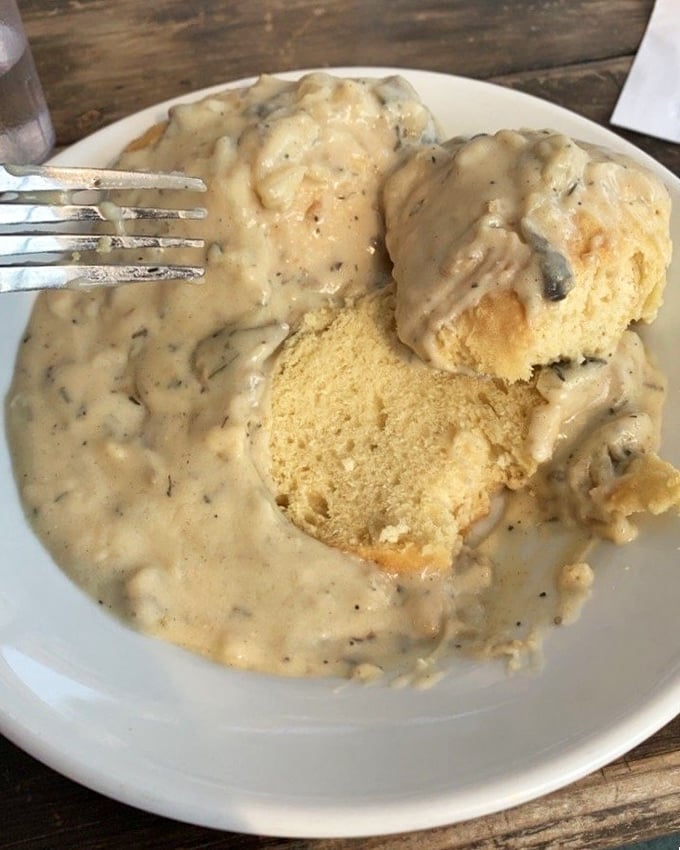 These biscuits and gravy aren't just breakfast&mdash;they're an edible hug. Golden, fluffy islands swimming in a sea of peppery, herb-flecked gravy.