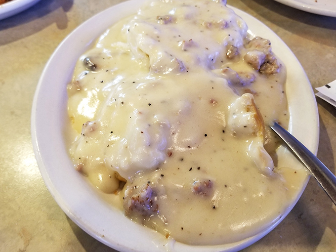 Behold the holy grail of Southern breakfast—biscuits and gravy so good you'll want to bathe in it. Pepper-speckled perfection that grandma would approve.