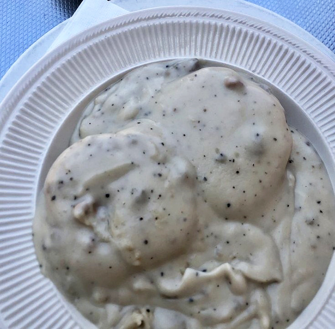 Behold the holy grail of Southern comfort &ndash; peppery sausage gravy that clings lovingly to each morsel, making every bite a creamy revelation.