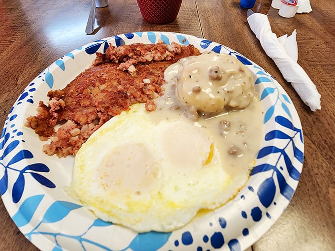 Breakfast architecture at its finest&mdash;a golden-yolked egg, crispy corned beef hash, and a biscuit swimming in gravy that could make a vegetarian reconsider their life choices.