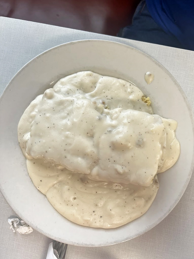 Behold the star attraction: biscuits and gravy that could make a grown adult weep with joy. Creamy, peppery perfection atop cloud-like biscuits.