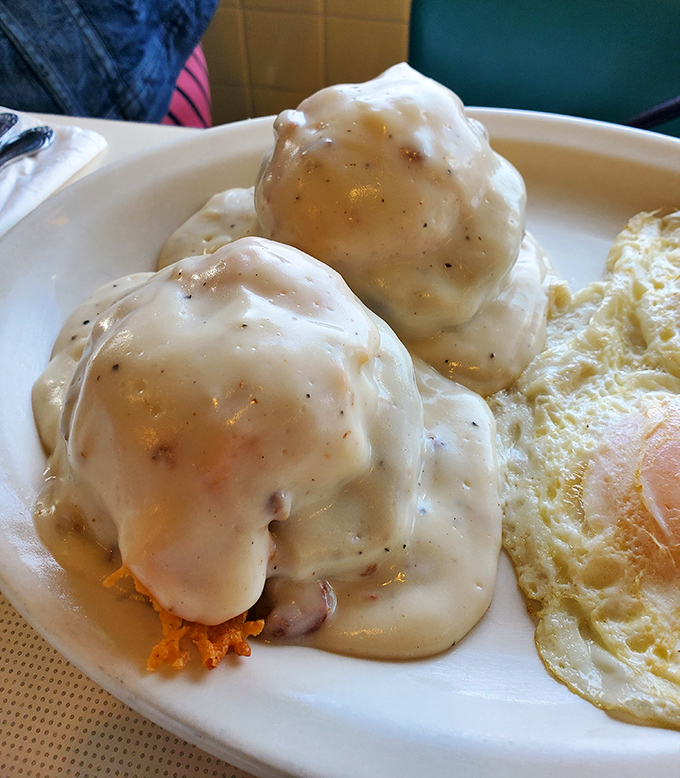 Behold the crown jewel: biscuits and gravy that would make your grandmother both proud and jealous. Those pepper flecks aren't just decoration—they're a promise of flavor.