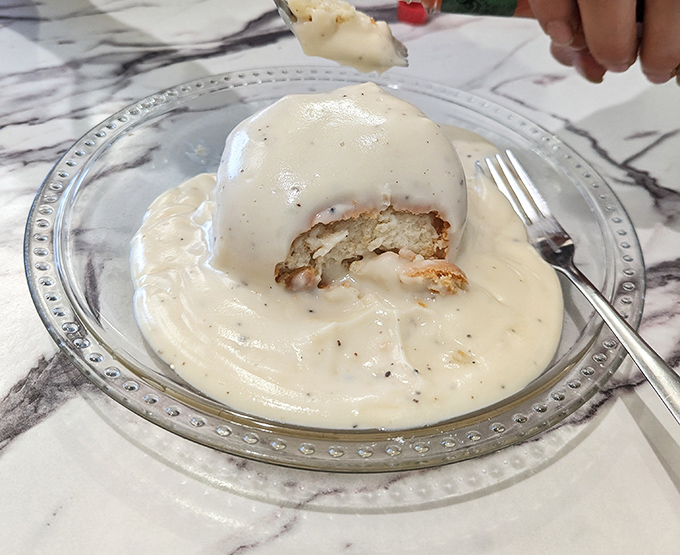 Behold the star attraction: a biscuit island in a sea of creamy, peppery gravy. This is what breakfast fantasies are made of.