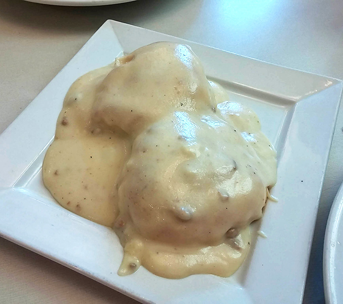 Behold the star attraction: biscuits and gravy that would make your grandmother both jealous and proud. Comfort on a plate.