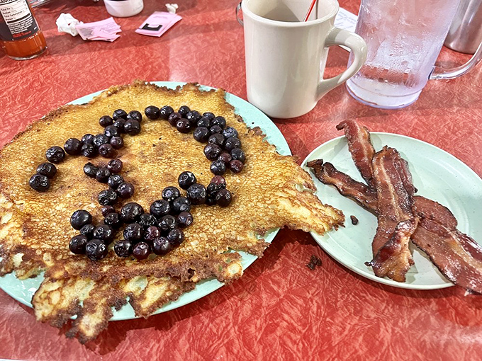 These blueberry hotcakes aren't just breakfast – they're edible morning poetry with crispy edges and berry-burst stanzas.