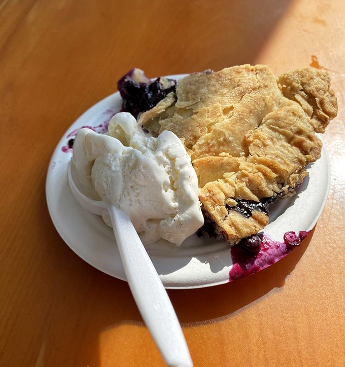 Maine's wild blueberries huddle together under a golden crust, creating the kind of pie that makes you question all other desserts you've ever loved.