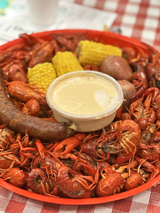 Crawfish heaven on a plate! These fiery red mudbugs surround corn, potatoes, and sausage like delicious sentinels guarding that creamy dipping sauce.